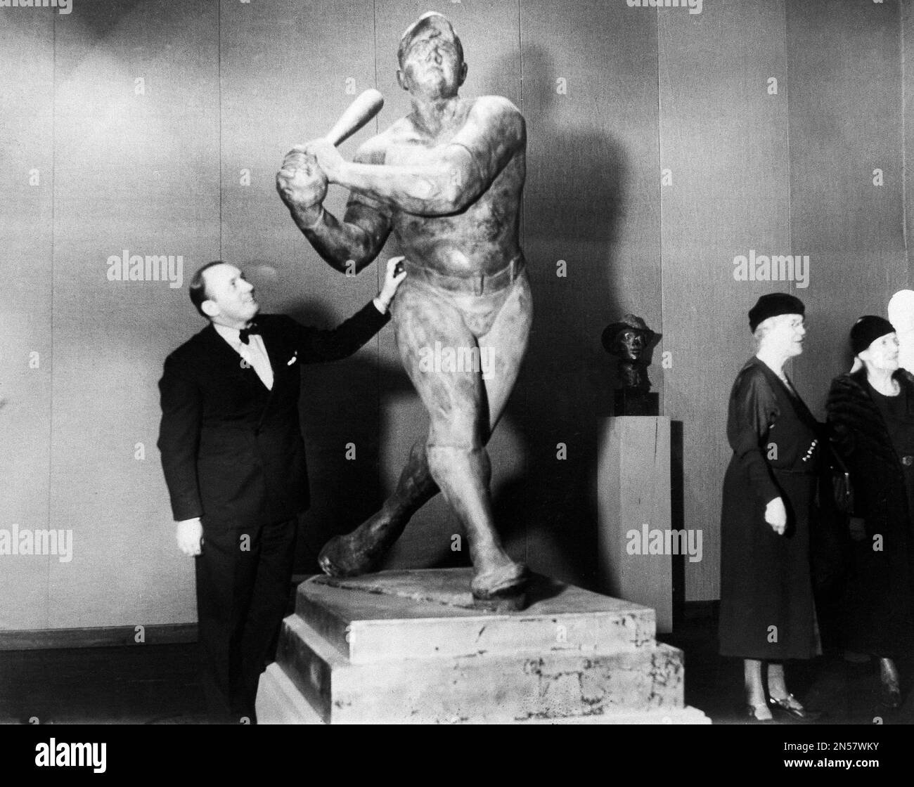 Robert L. Ripley is shown with a sculpture of Babe Ruth at the first ...