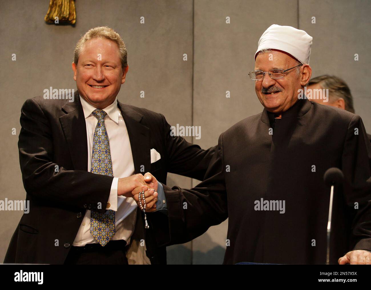 Australian mining magnate Andrew Forrest, left, shakes hands with Dr ...
