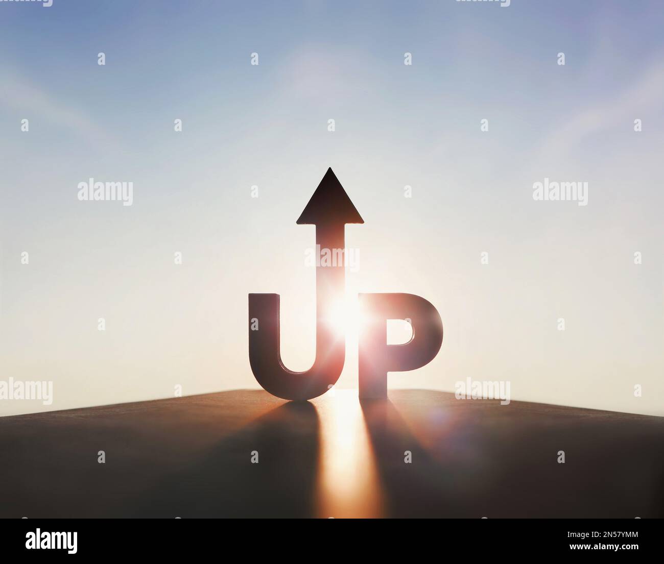 New year sunrise and sun rising bright between upward arrow and UP and ...