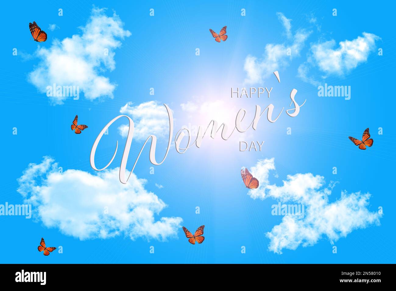 sky with clouds and sun through which butterflies fly Stock Photo - Alamy