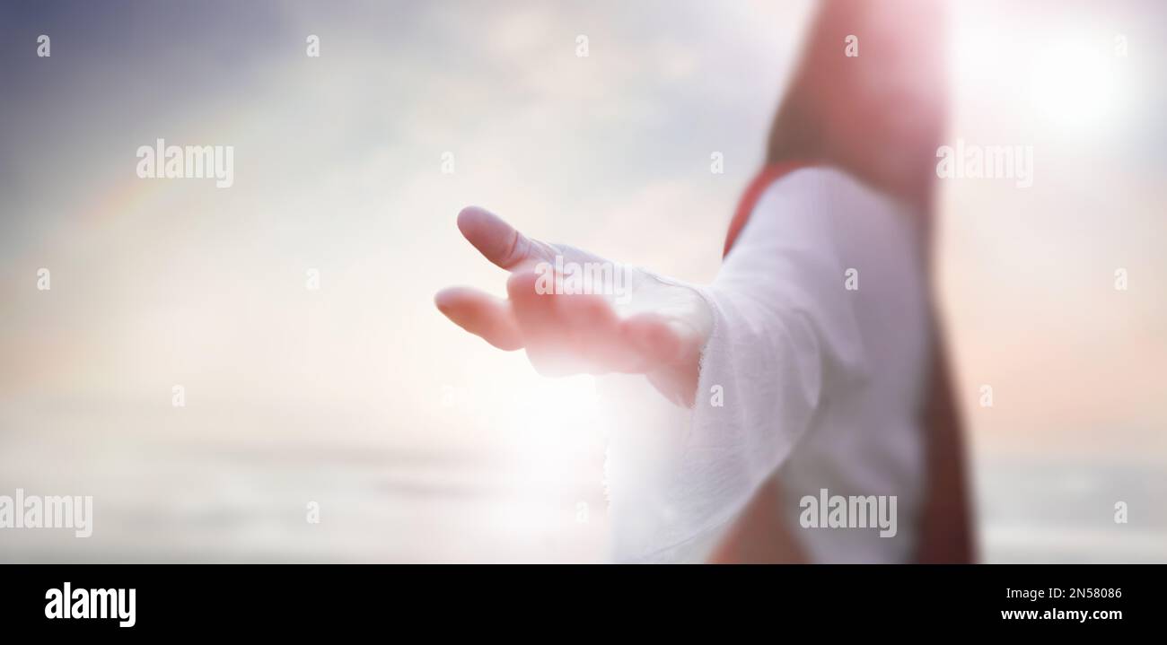 Resurrected Jesus Christ reaching out with open arms in the sky, heaven ...