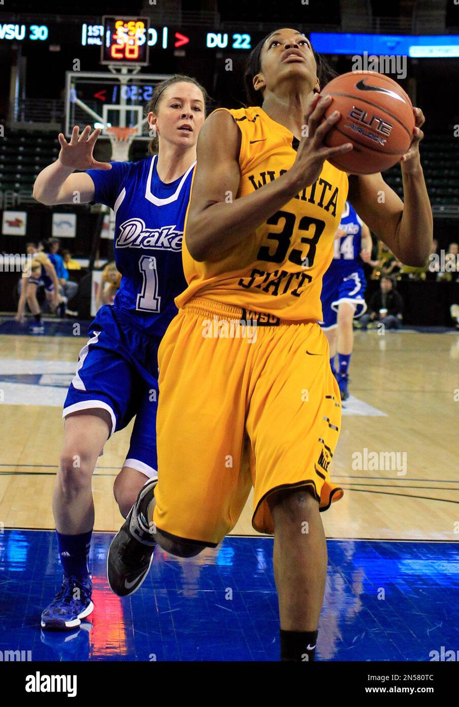 Wichita State's Michelle Price (33) heads to the basket as Drake's ...