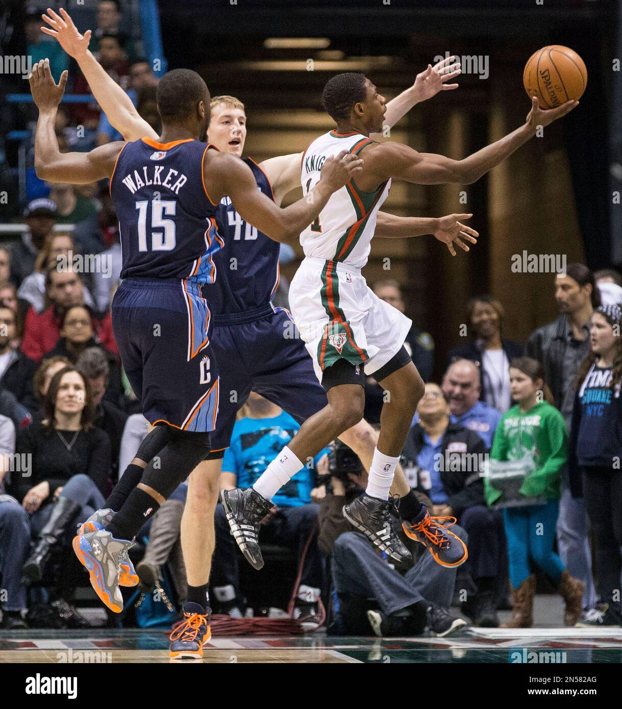 Milwaukee Bucks' Brandon Knight, right, drives between Charlotte ...