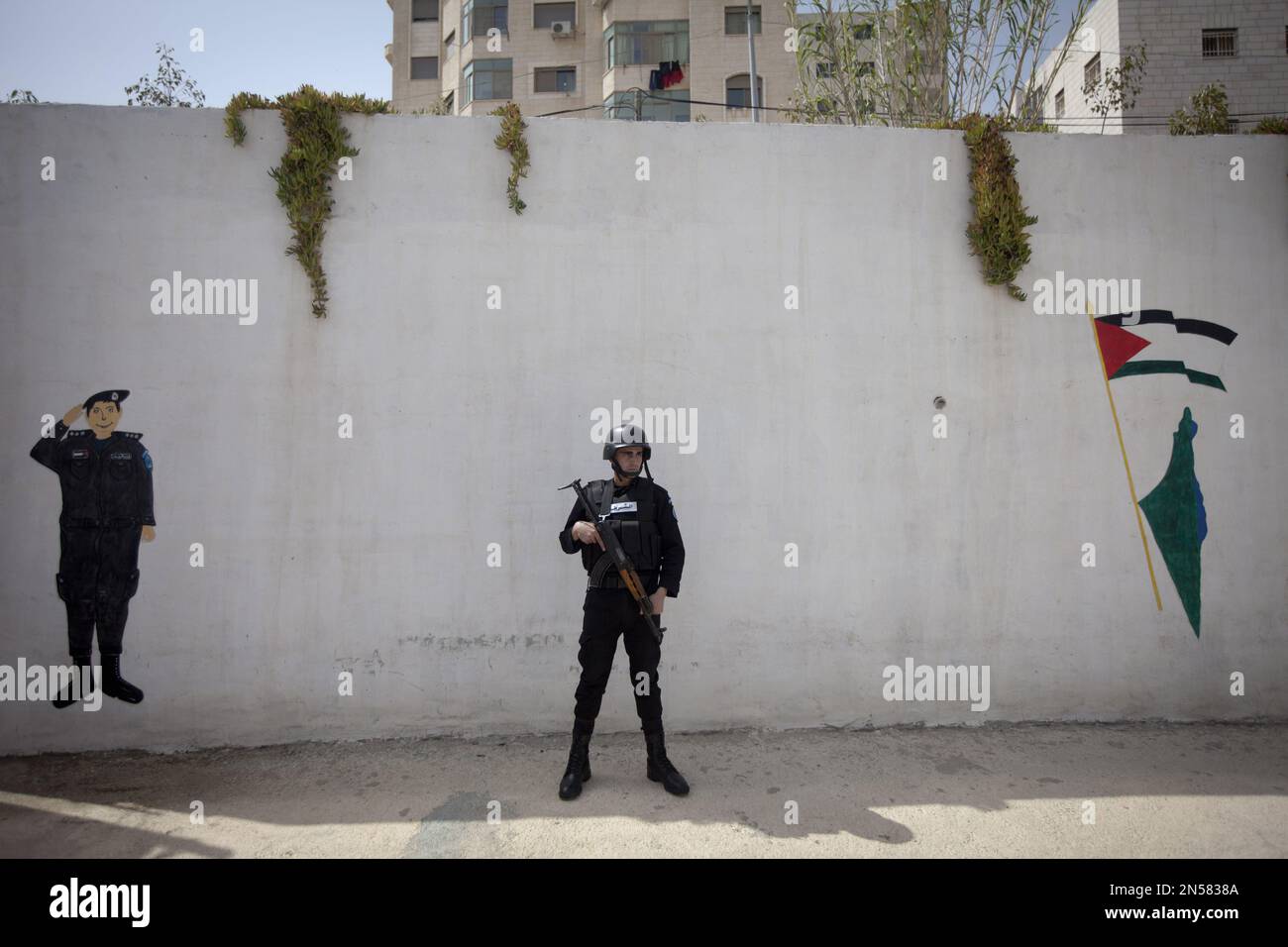 Palestinian policeman stands during a training session of the ...