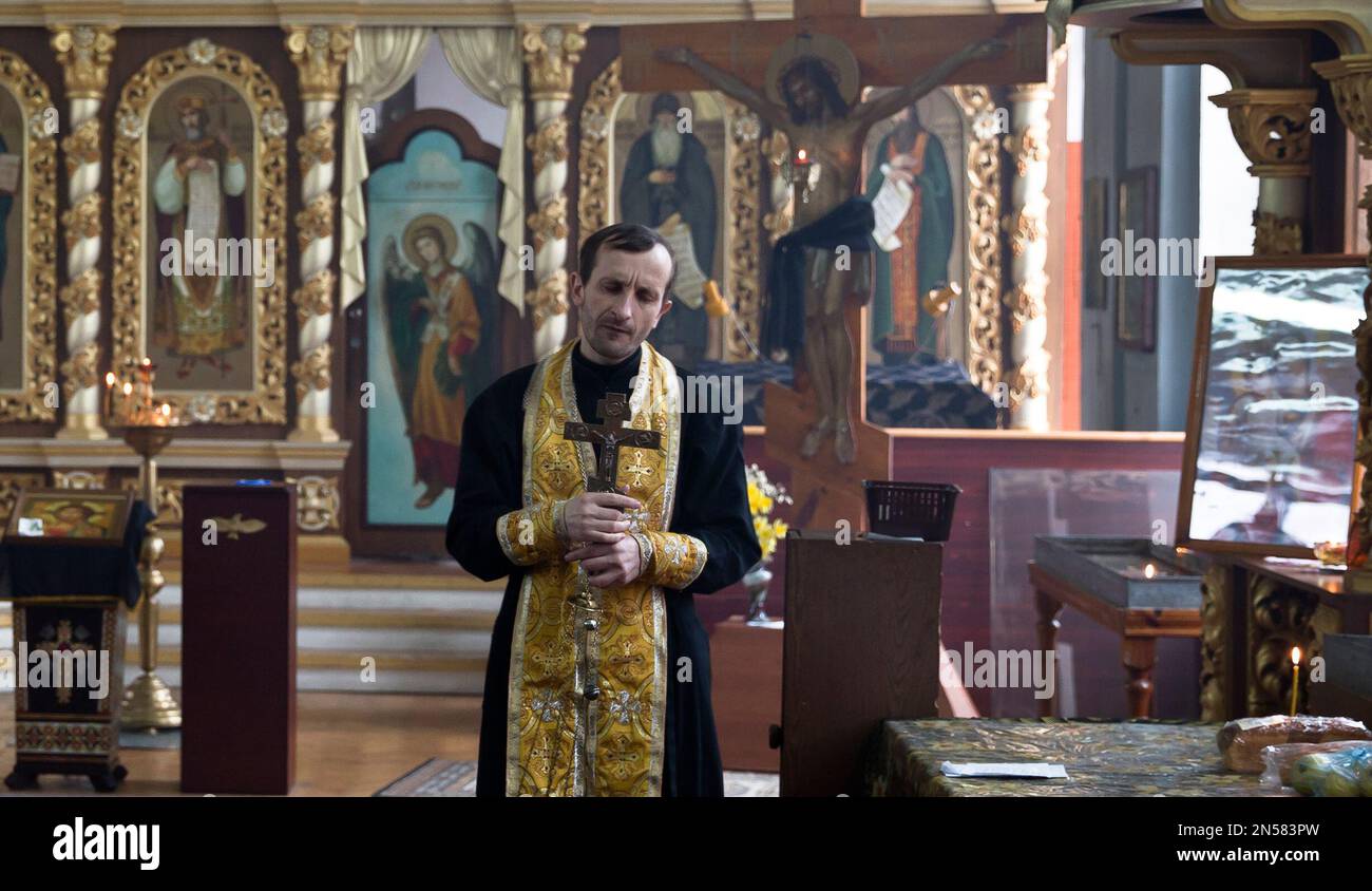 A Ukrainian Orthodox priest performs a religious service at the Saint ...