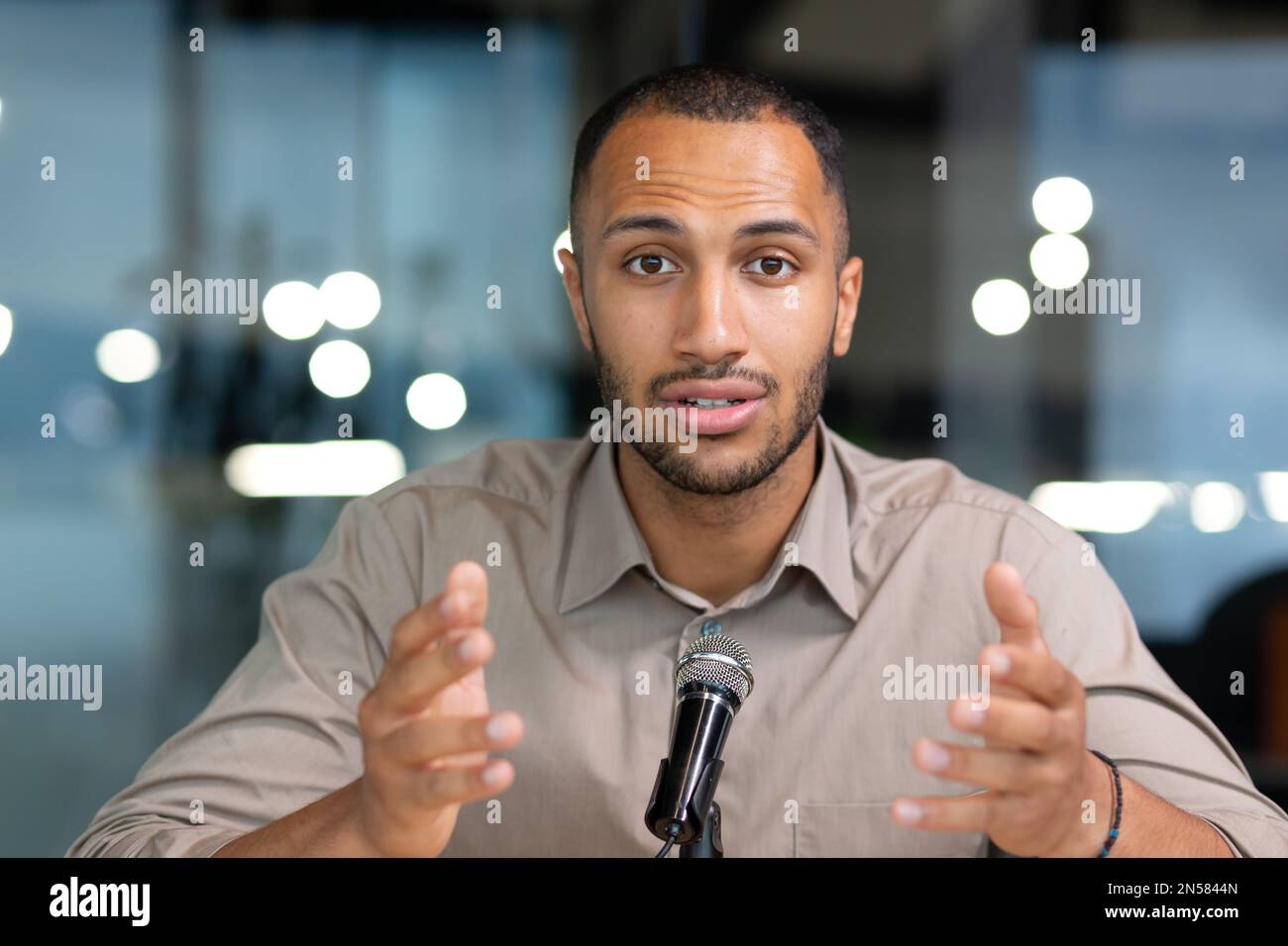 Closeup portrait man with a professional microphone, African American ...