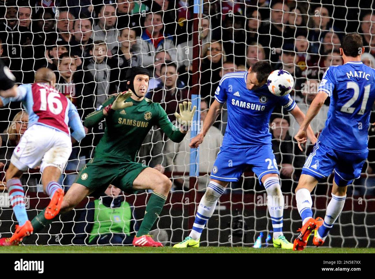 Aston Villa's Fabian Delph, left, scores past Chelsea's John Terry ...