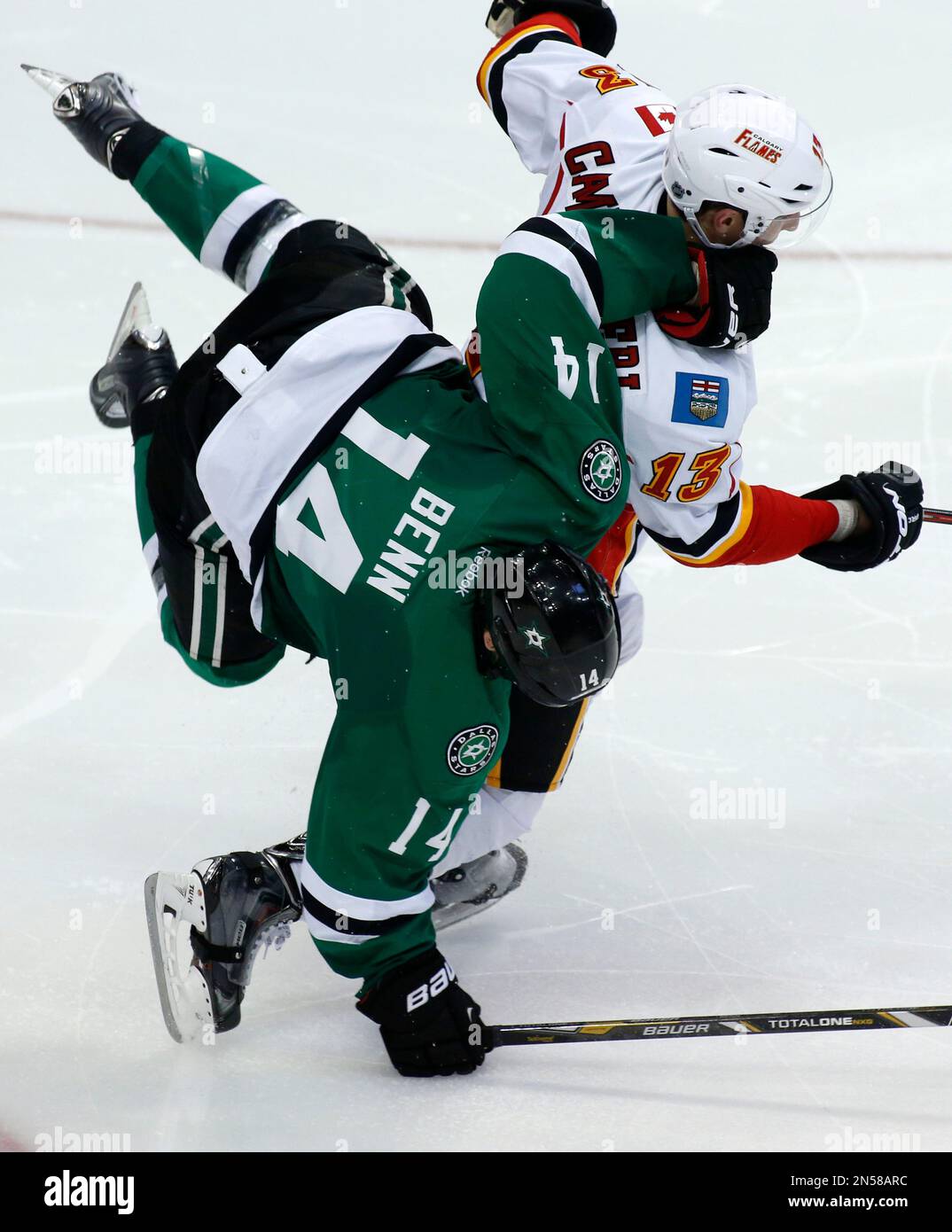 Dallas Stars center Jamie Benn (14) flips over Calgary Flames center ...