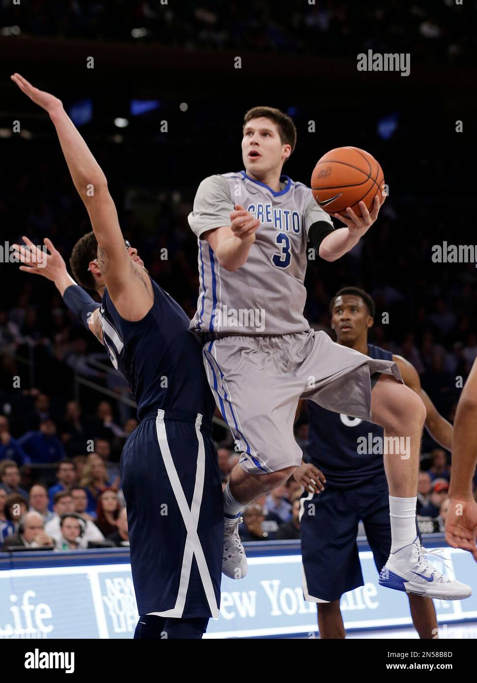 Creighton's Doug McDermott (3) drives past Xavier's Isaiah Philmore ...