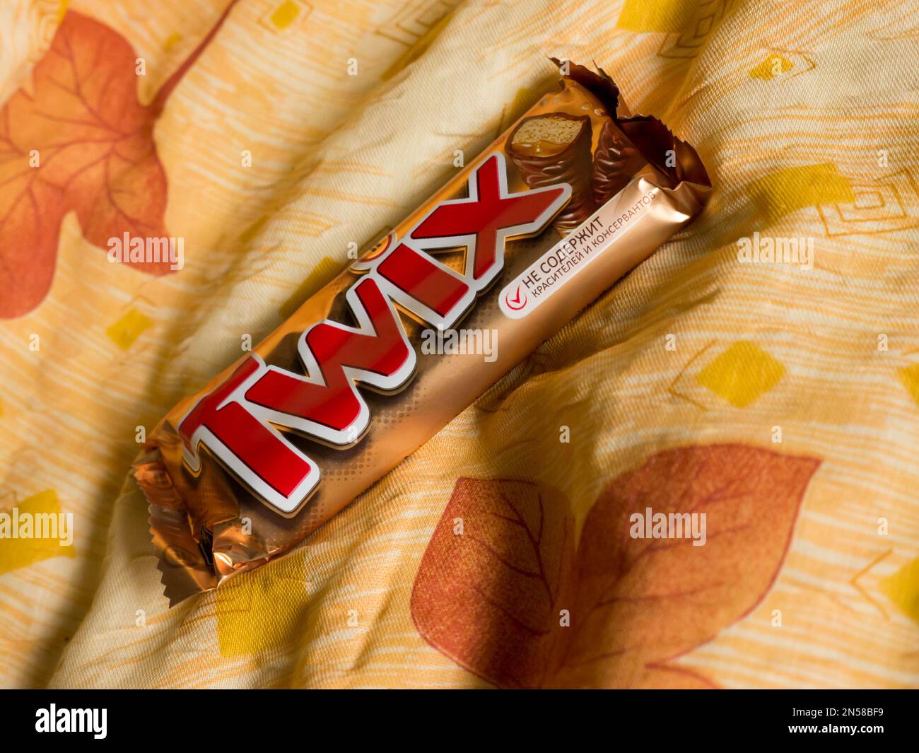 Twix cookie bars on a brown background. Twix is a chocolate bar made by ...