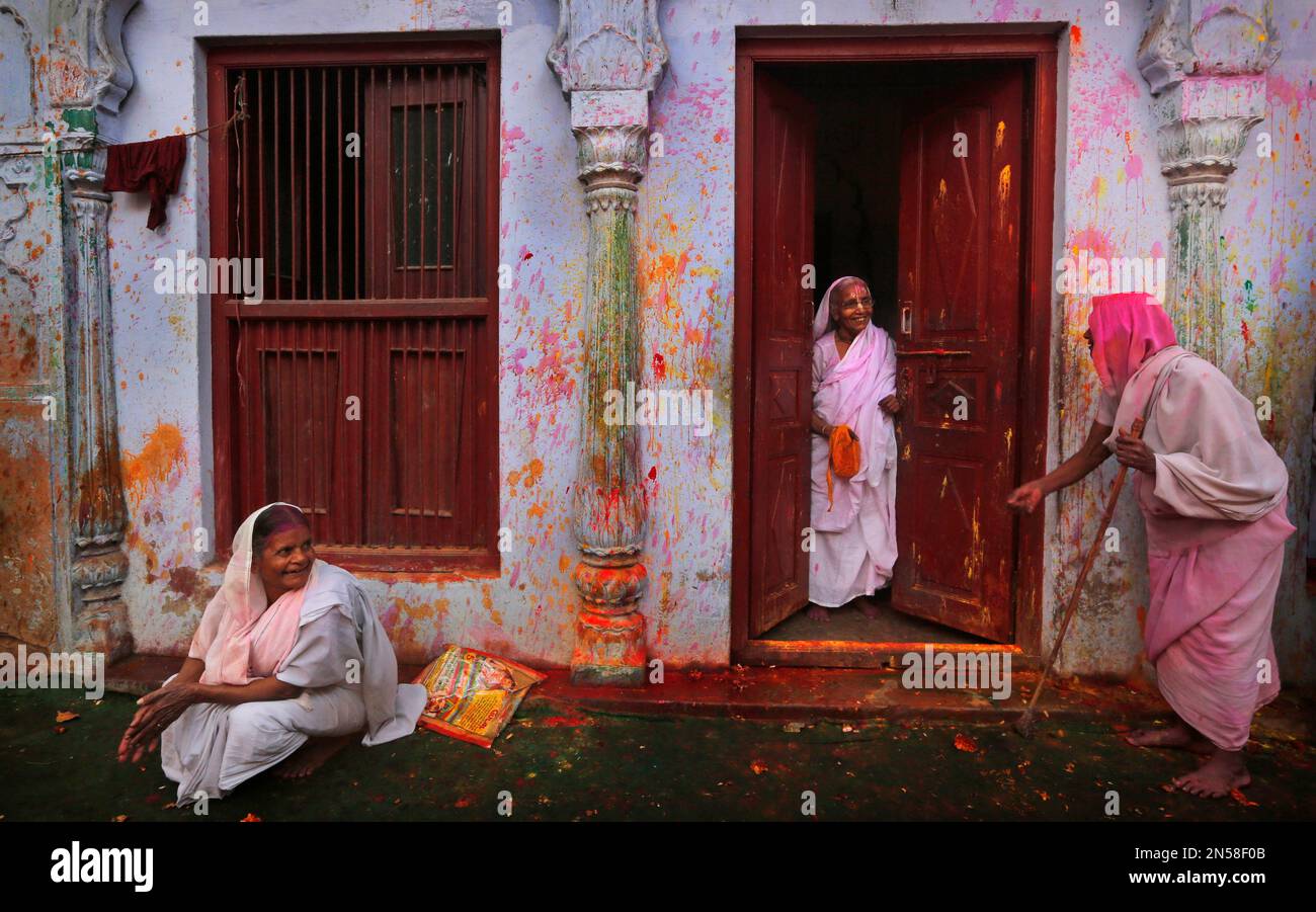 Indian Hindu widows clean their house after playing holi with colored ...