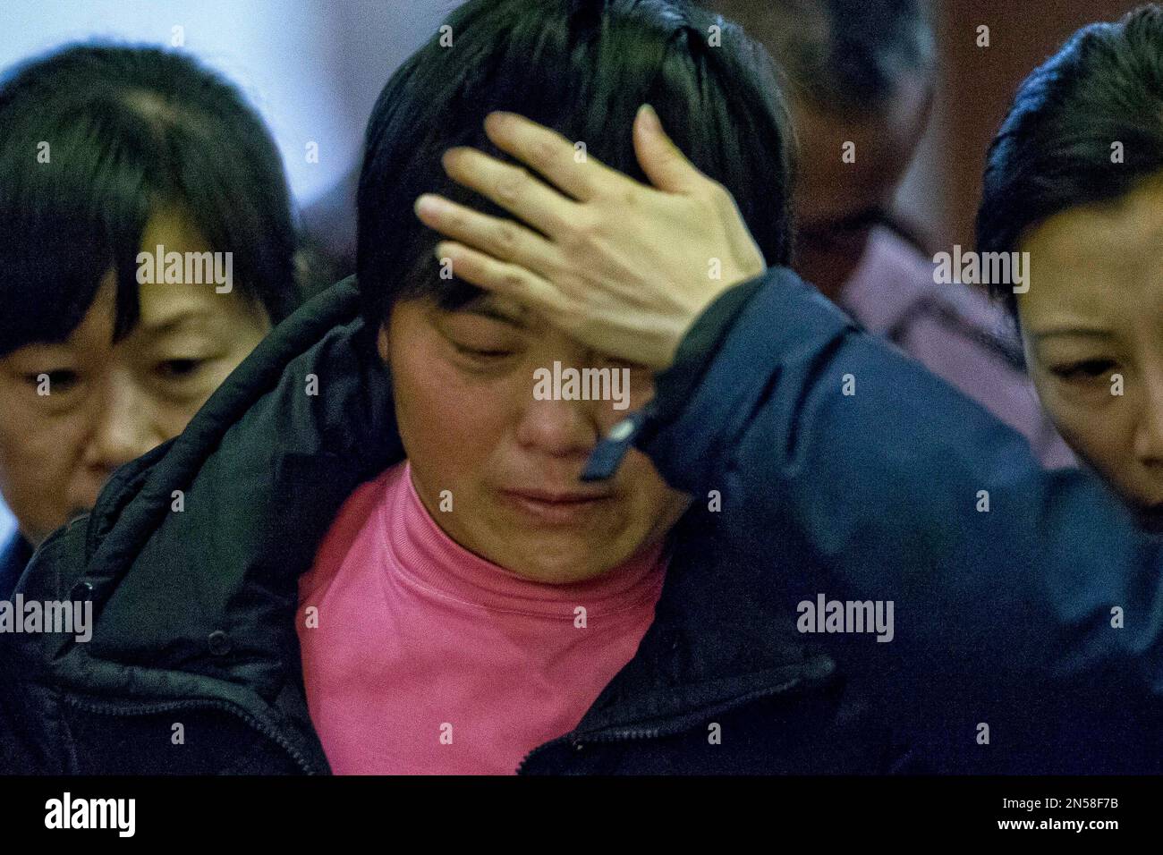 A crying woman, one of the relatives of Chinese passengers aboard ...