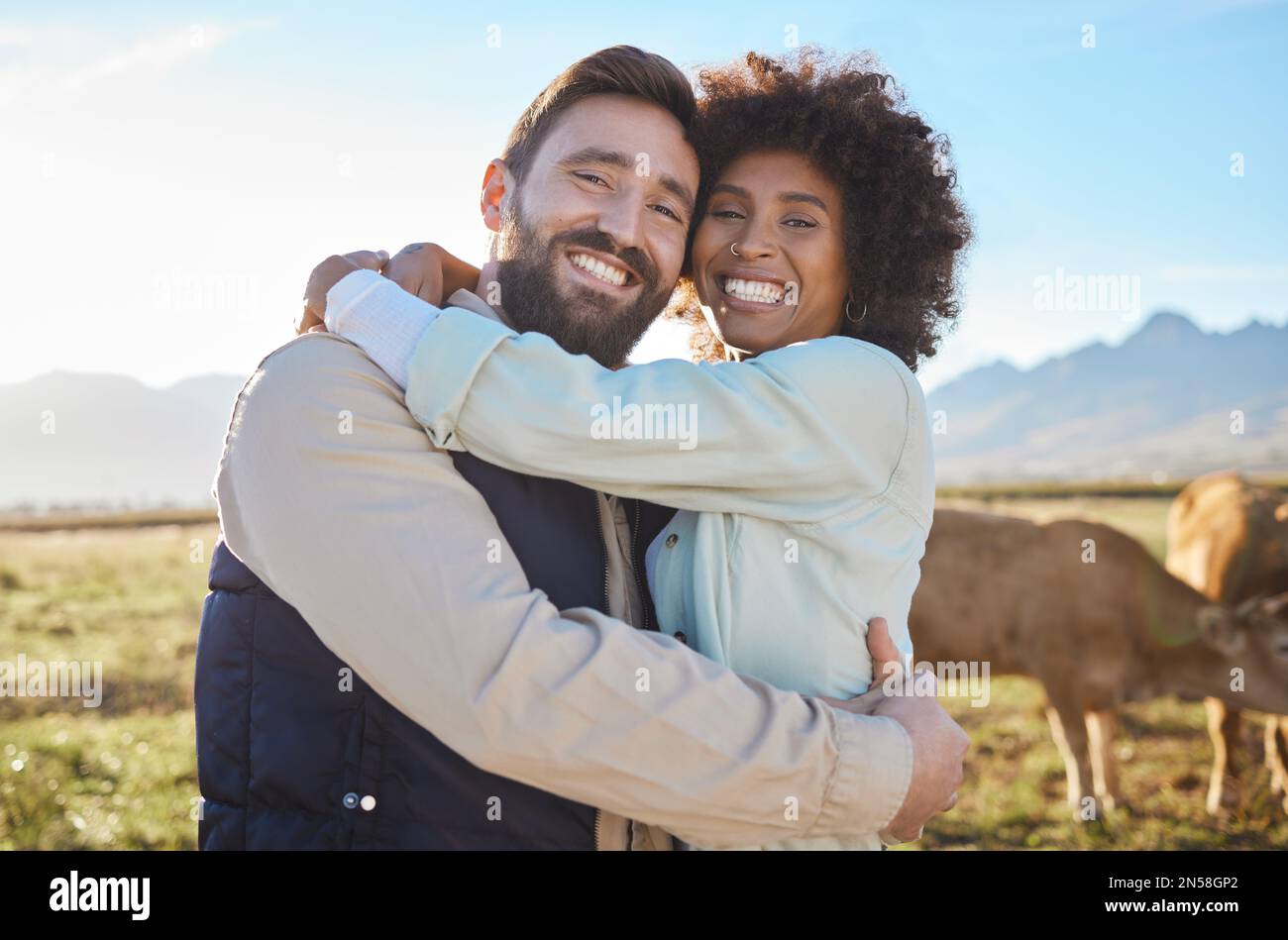 Love, cow and smile with interracial couple on farm for agriculture ...