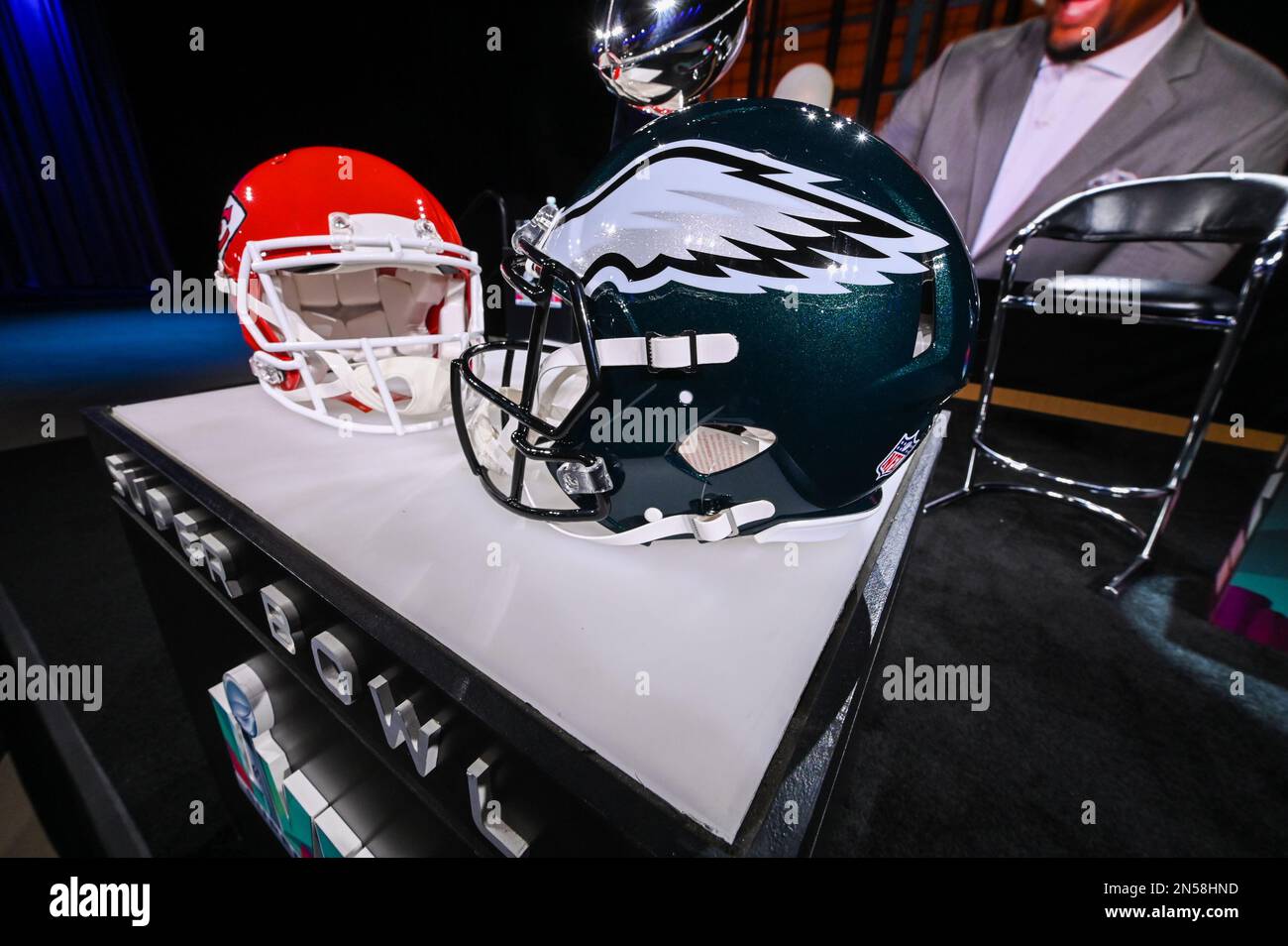 The Vince Lombardi trophy and helmets for the Chiefs and Eagles sit on ...