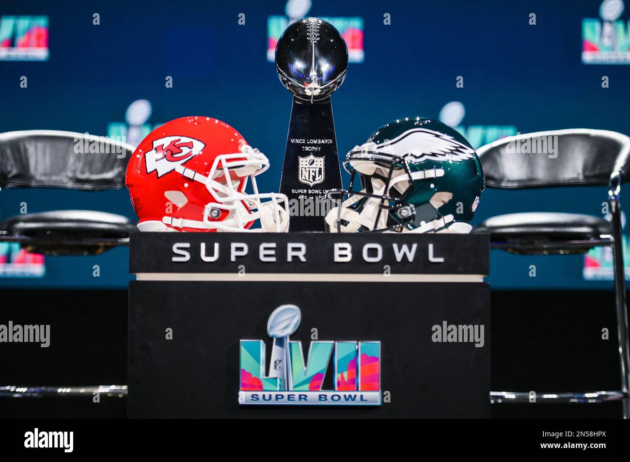The Vince Lombardi trophy and helmets for the Chiefs and Eagles sit on ...