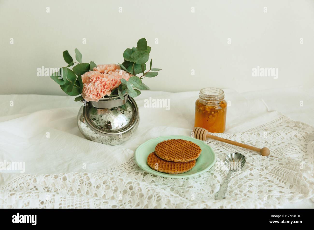 waffles and honey with flower on the table. PINK BLUSH STILL LIFE Stock ...