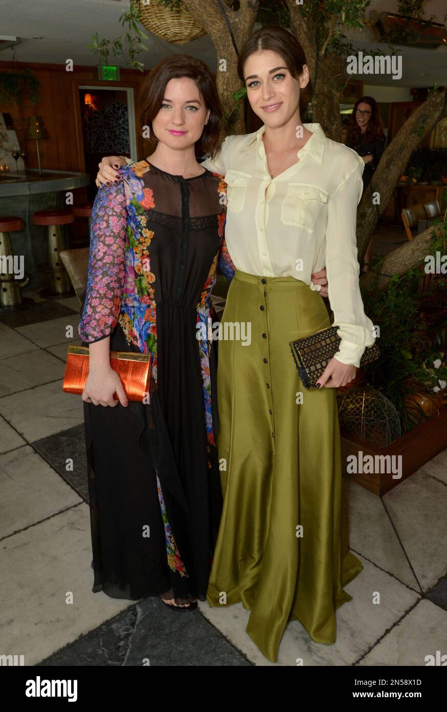 Ilaria Urbinati, left and Lizzy Caplan attend The Hollywood Reporter ...