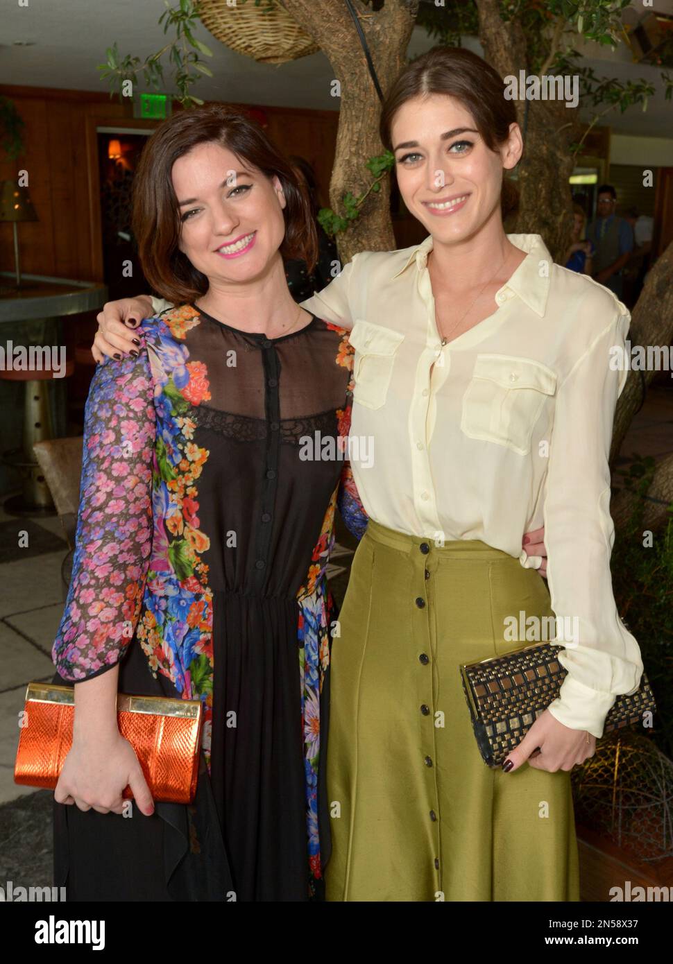 Ilaria Urbinati, left and Lizzy Caplan attend The Hollywood Reporter ...