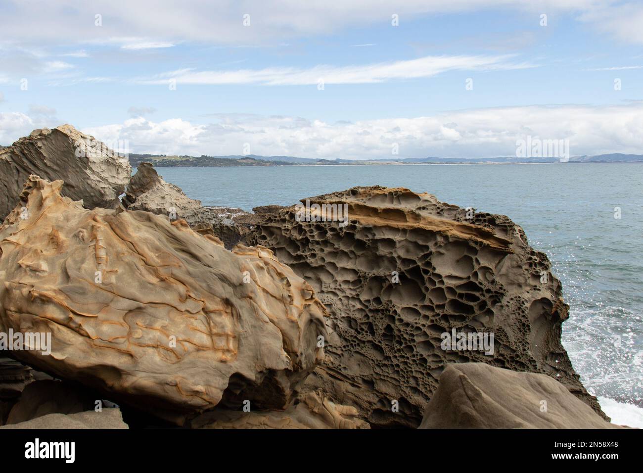 The view of coastline with big rocks and blue sea on background ...