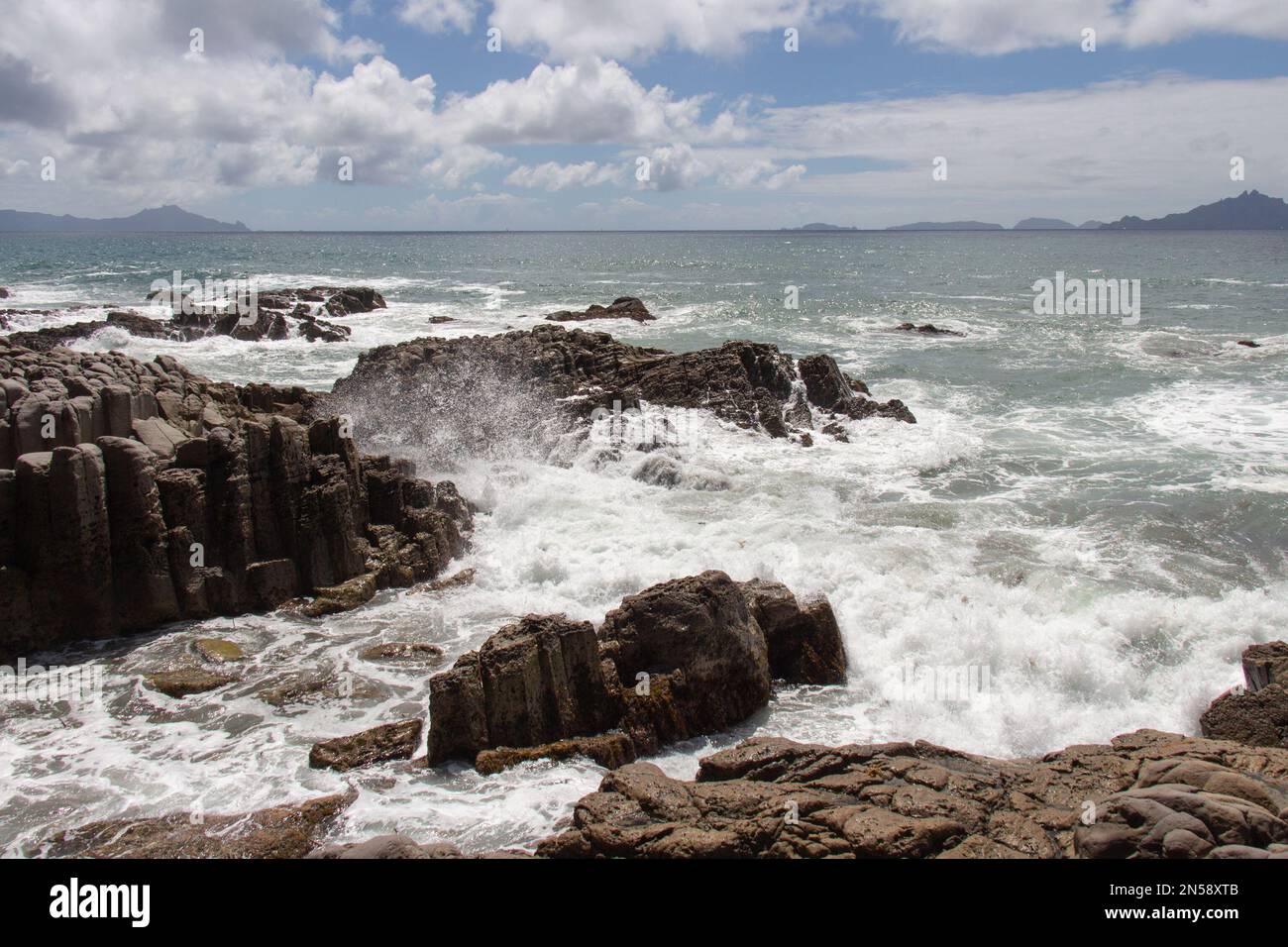 The view of seascape with rocks and blue sea in a sunny day, near ...