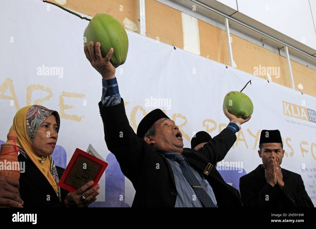 Malaysian well-known shaman Ibrahim Mat Zin, center, uses spiritual ...