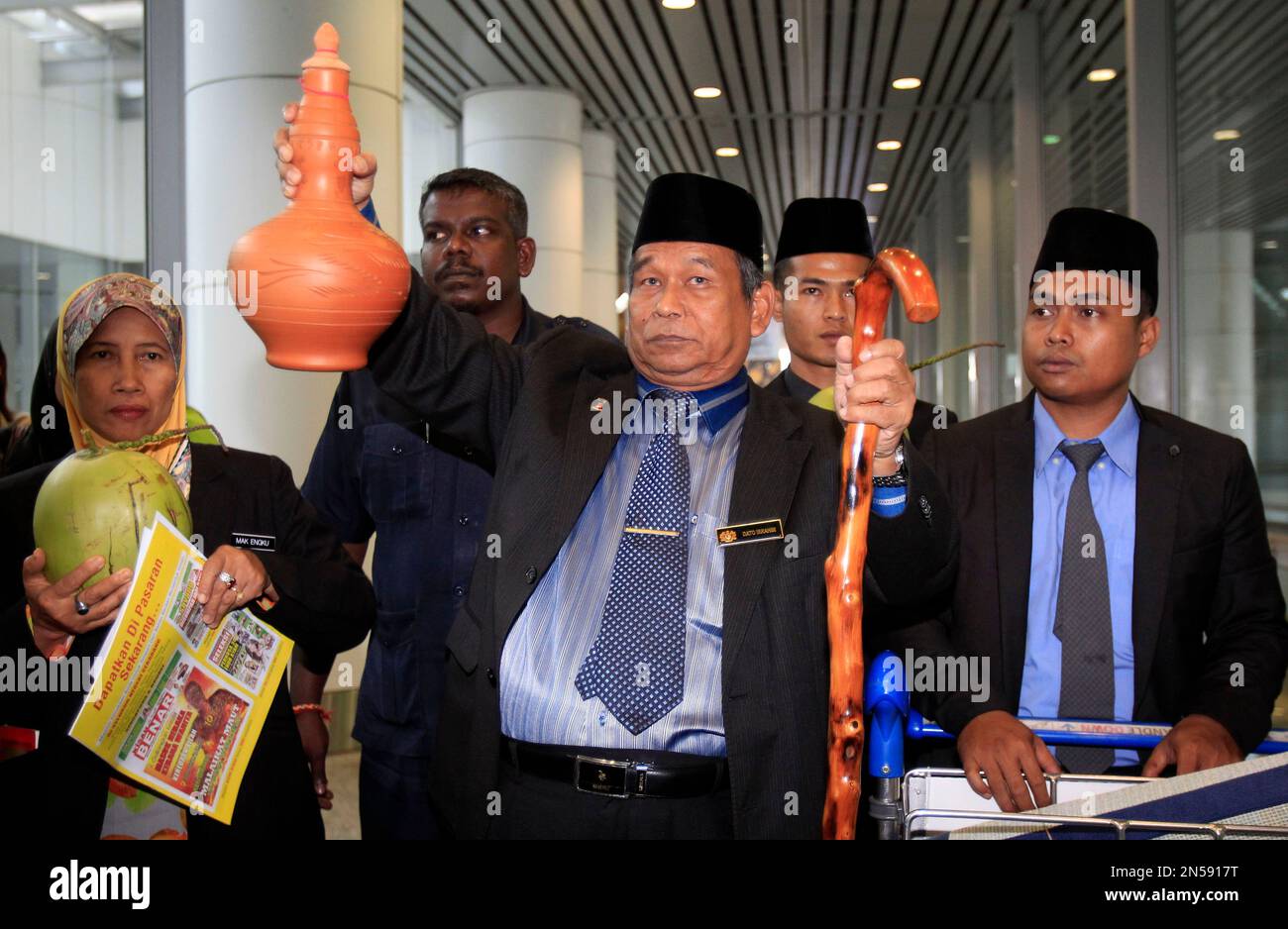 Malaysian well-known shaman Ibrahim Mat Zin, center, uses spiritual ...