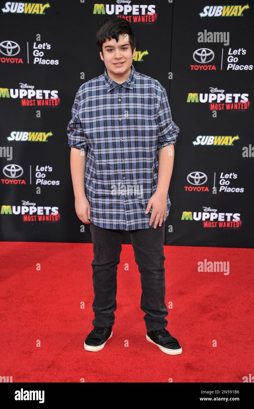 Devan Leos arrives at the World Premiere of "Muppets Most Wanted" on Tuesday, March 11, 2014, in ...