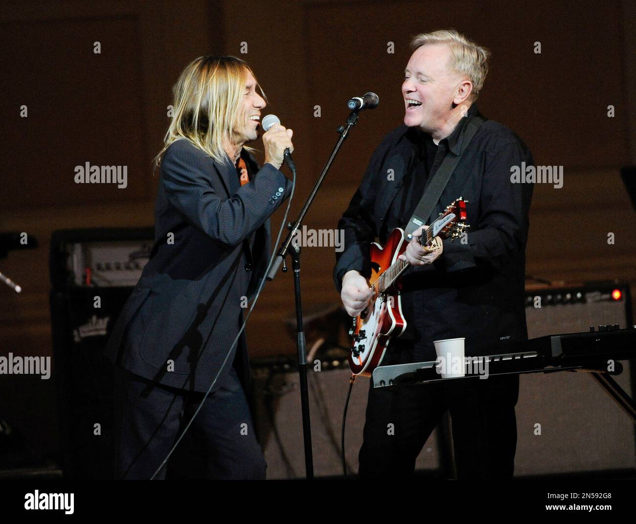 Musicians Iggy Pop, left, and Bernard Sumner perform together at the ...