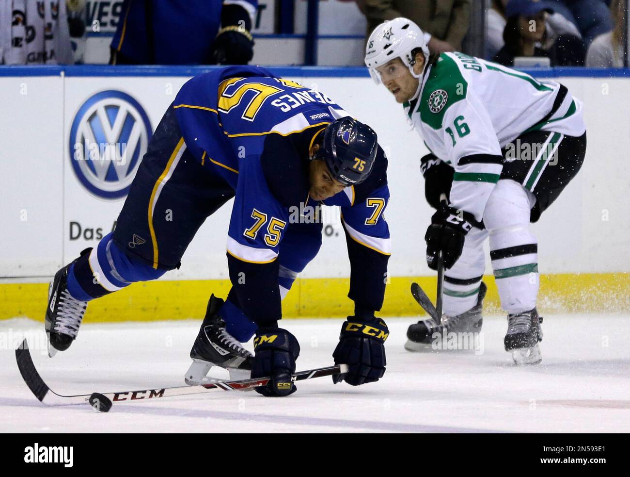 St. Louis Blues' Ryan Reaves, left, tries to control the puck as Dallas ...