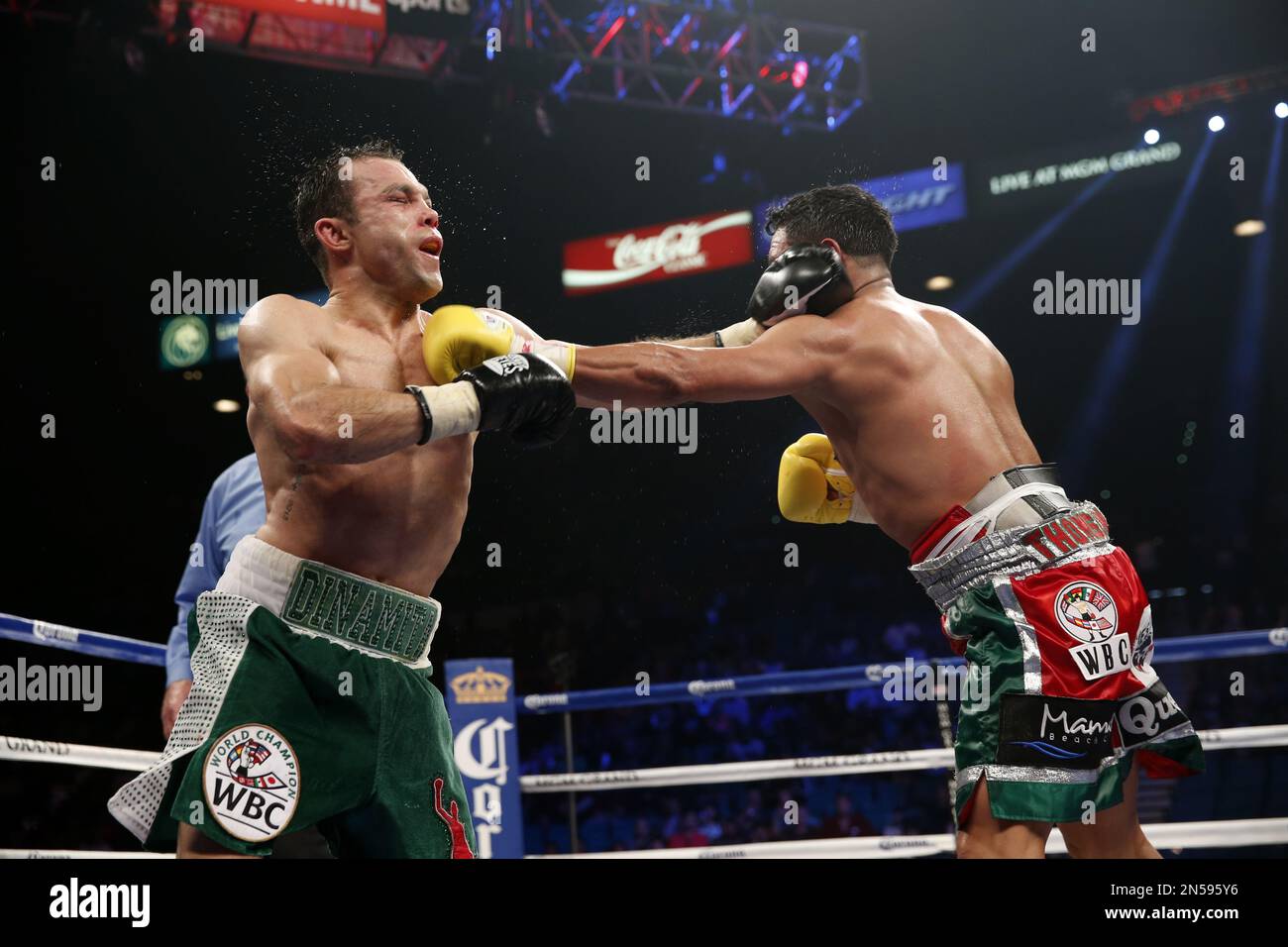 Ricardo Alvarez of Guadalajara Mexico trades punches with Sergio Thompson of Chetumal Mexico ...
