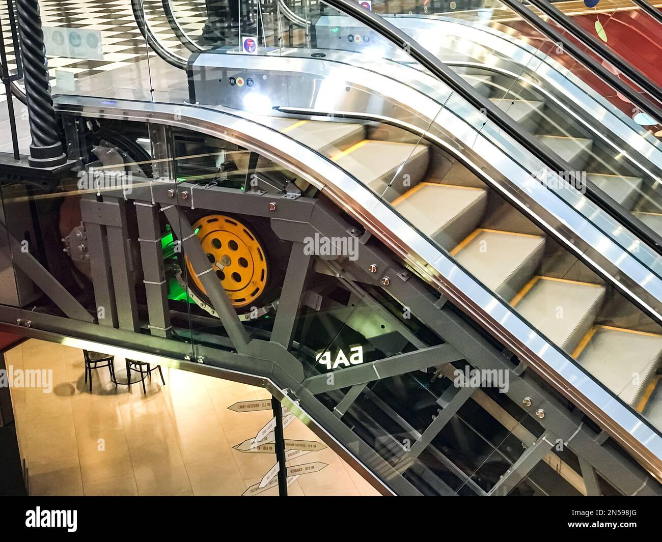 Escalator device inside a modern moving staircase lifting transport ... Escalator device inside a modern moving staircase lifting transport ...