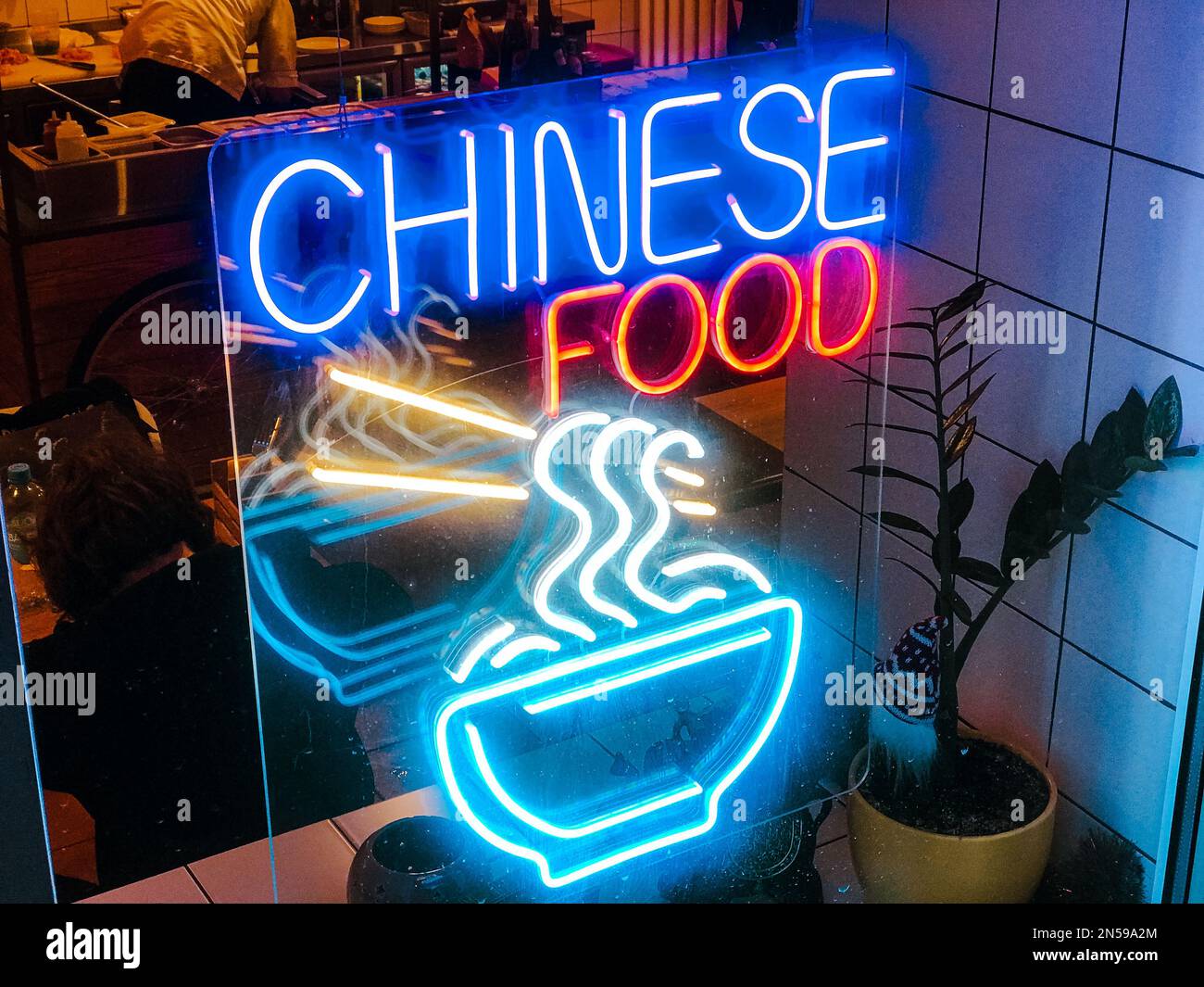 Neon sign Chinese food, advertising billboard,blue cyan color light ...