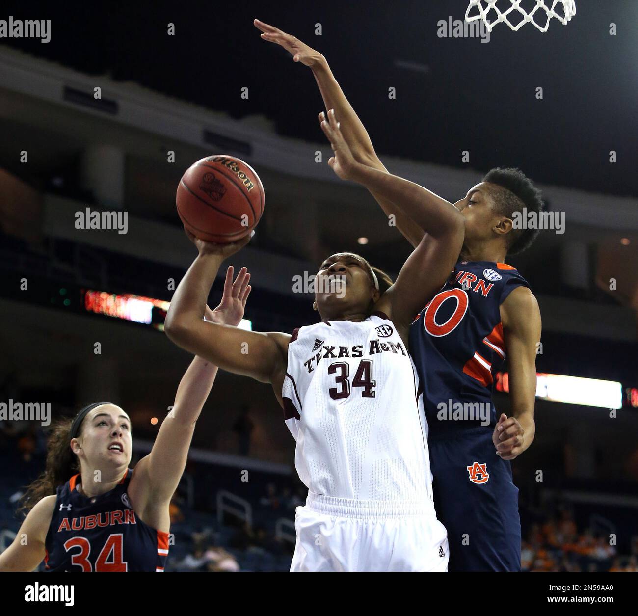 Texas A&M center Karla Gilbert (34) goes up for a basket against Auburn ...