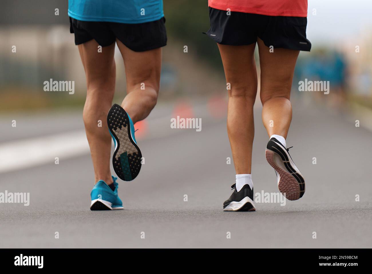 Run man and woman runners couple fit people jogging training for ...