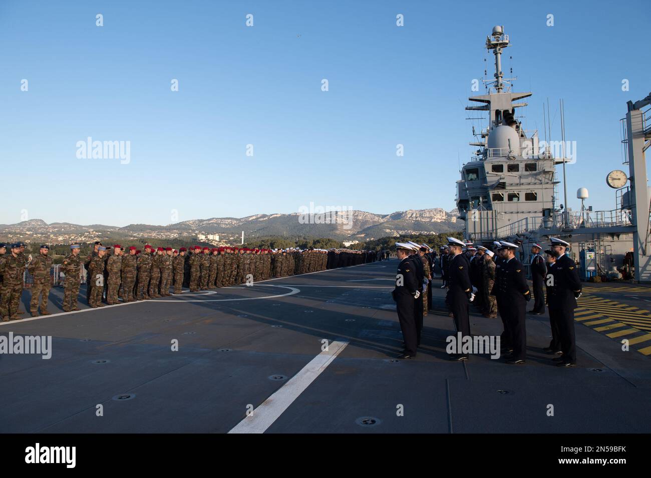 The ceremony is held on the flight deck of the amphibious helicopter ...