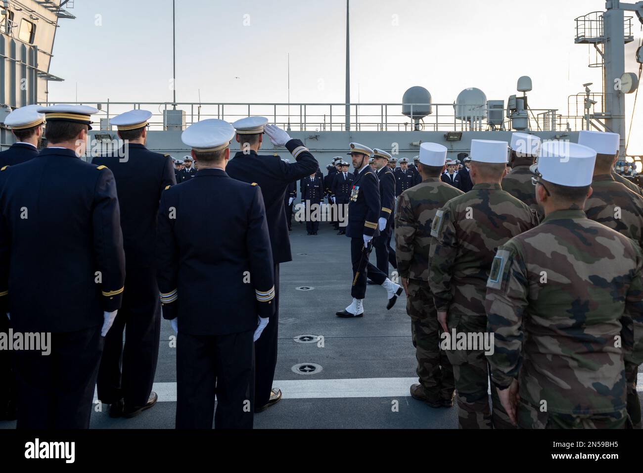 The ceremony is held on the flight deck of the amphibious helicopter ...