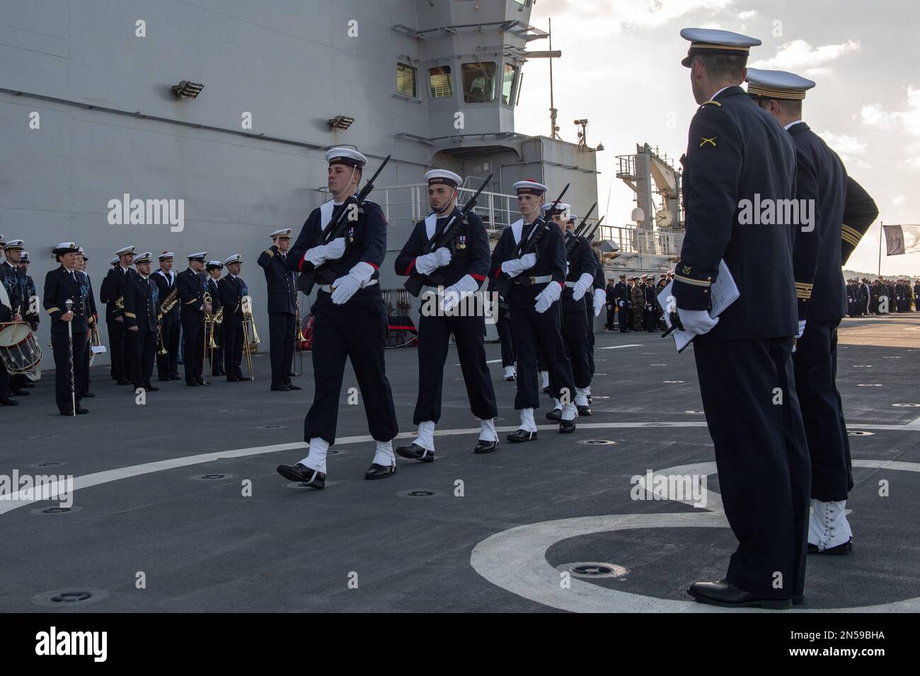 The ceremony is held on the flight deck of the amphibious helicopter ...