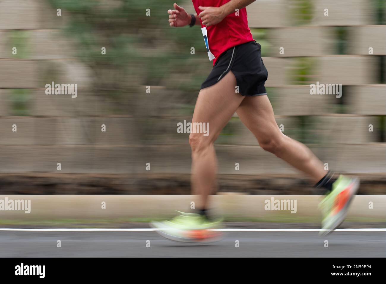 Panning to add blurred motion to runner racing in marathon Stock Photo ...
