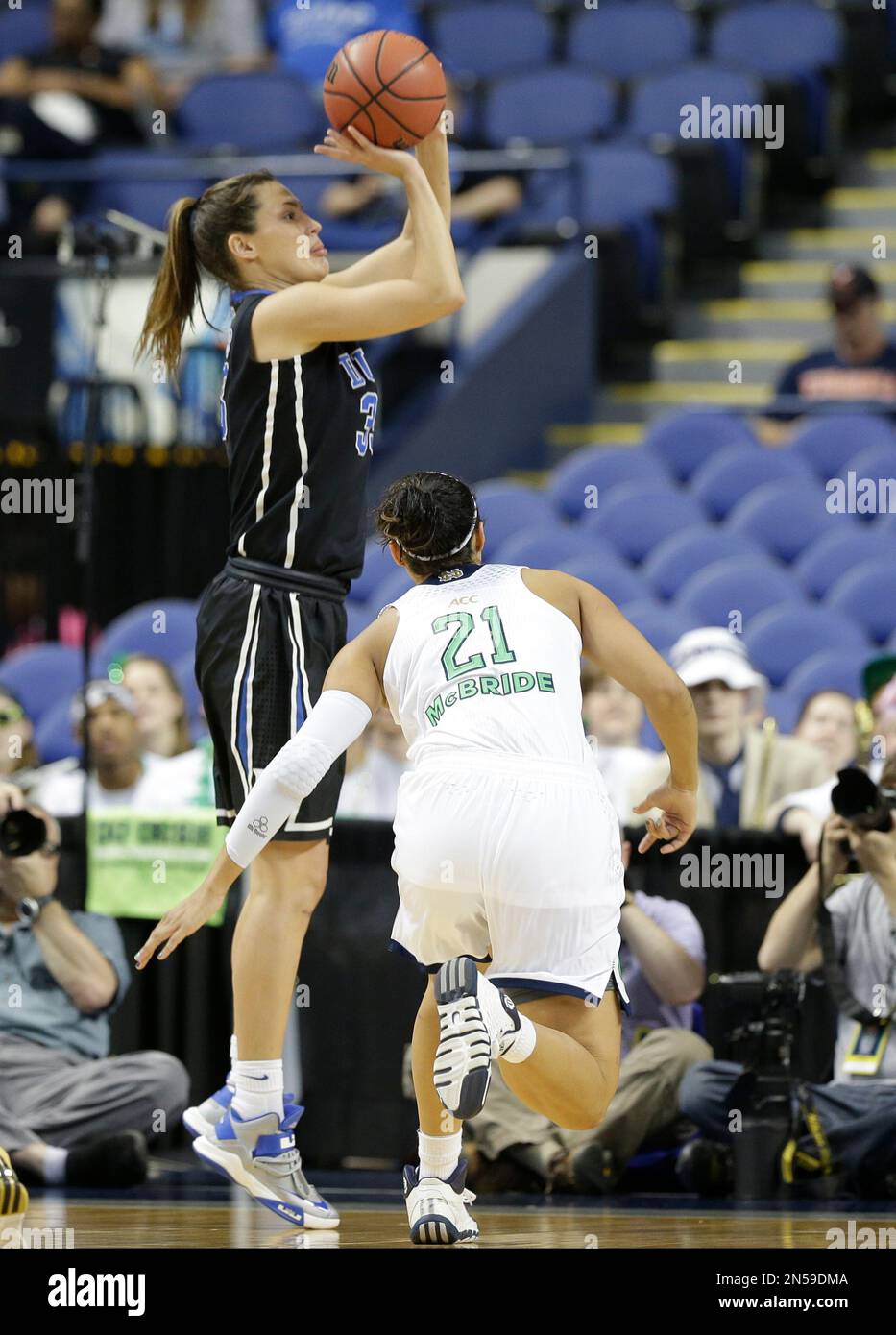 Duke's Haley Peters (33) shoots over Notre Dame's Kayla McBride (21 ...