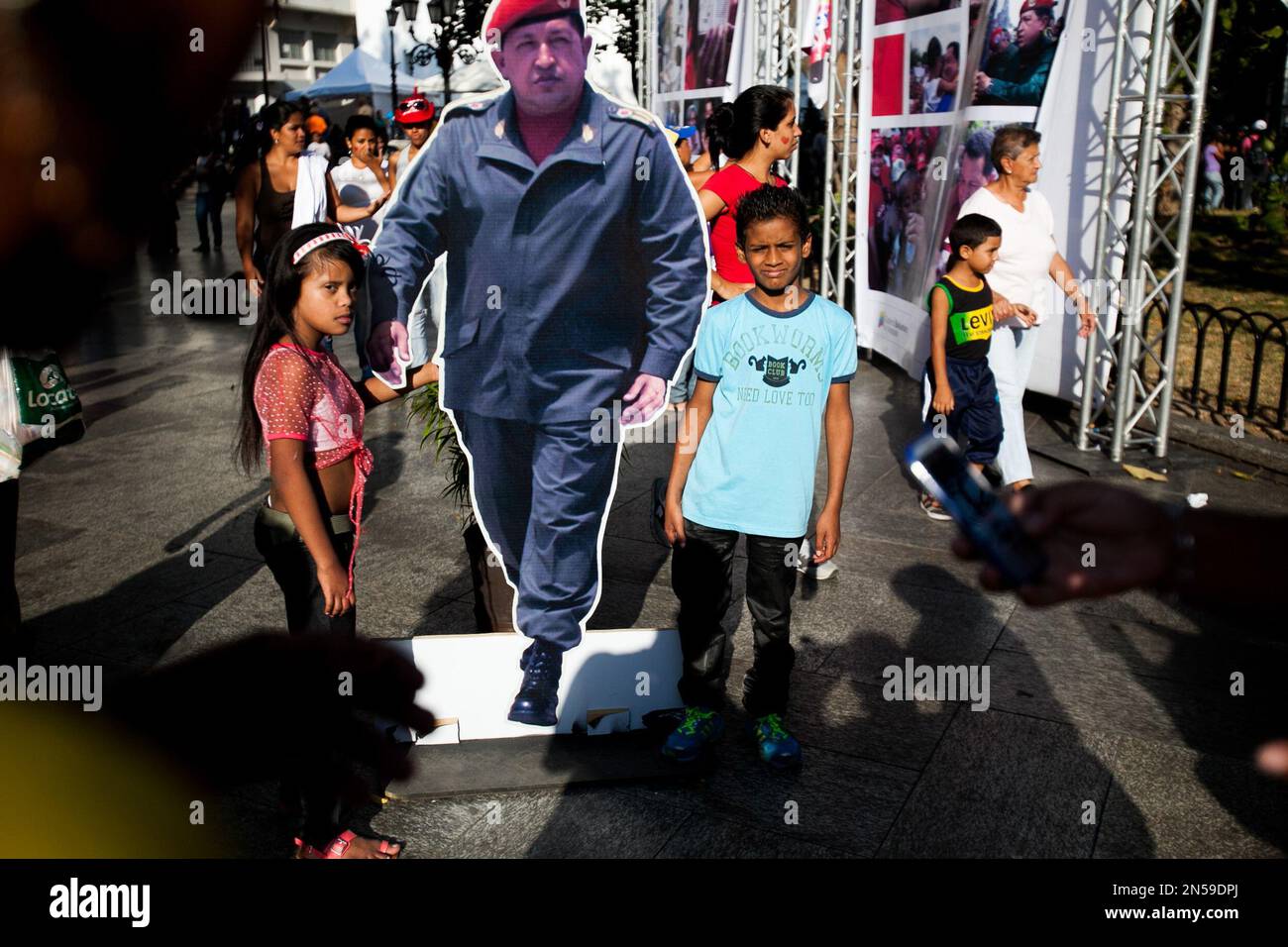 In this Saturday, March 8, 2014 photo, children pose with a life-size ...