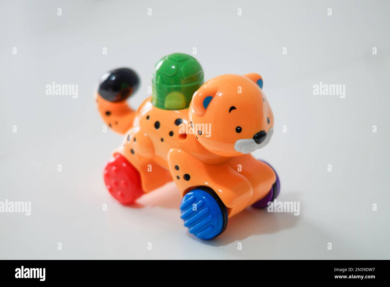 Children's plastic toy. Green ladybug car on a white background Stock ...