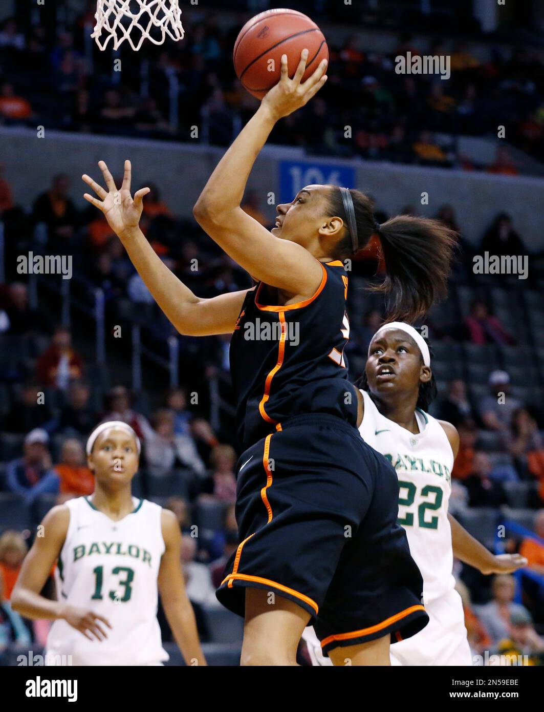 Oklahoma State center Kendra Suttles, center, shoots in front of Baylor ...