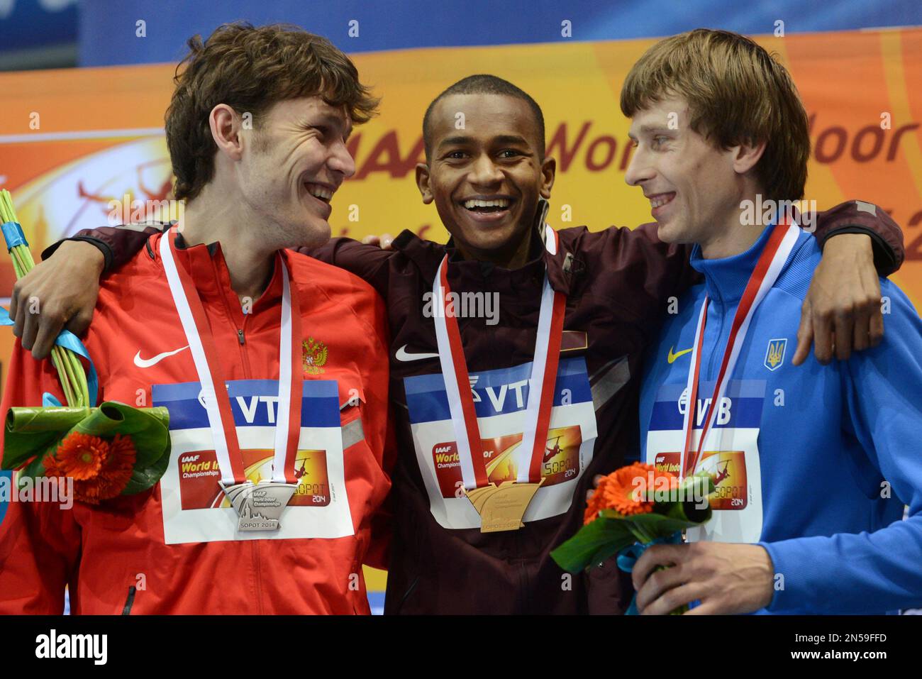 Qatar's gold medal winner Mutaz Essa Barshim hugs Russia's silver medal ...