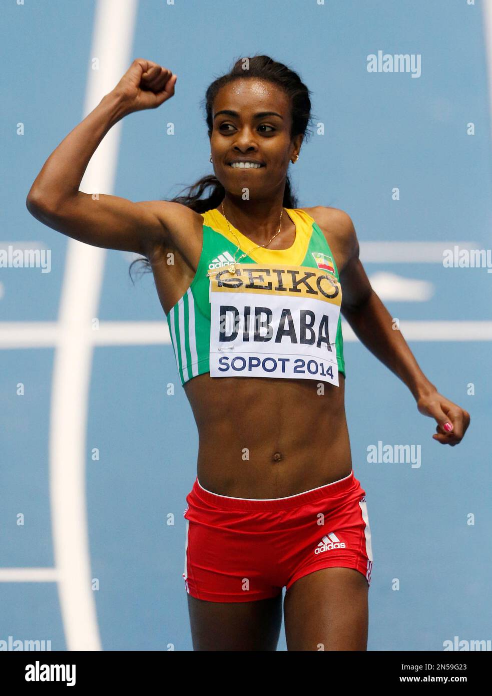 Ethiopia's Genzebe Dibaba crosses the finish line to win the 3000m ...