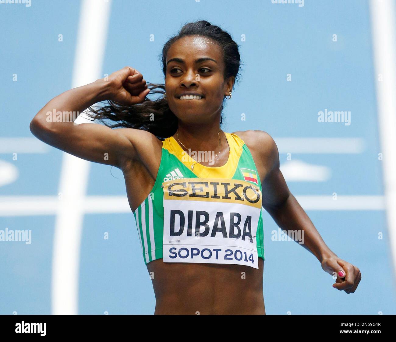 Ethiopia's Genzebe Dibaba crosses the finish line to win the 3000m ...