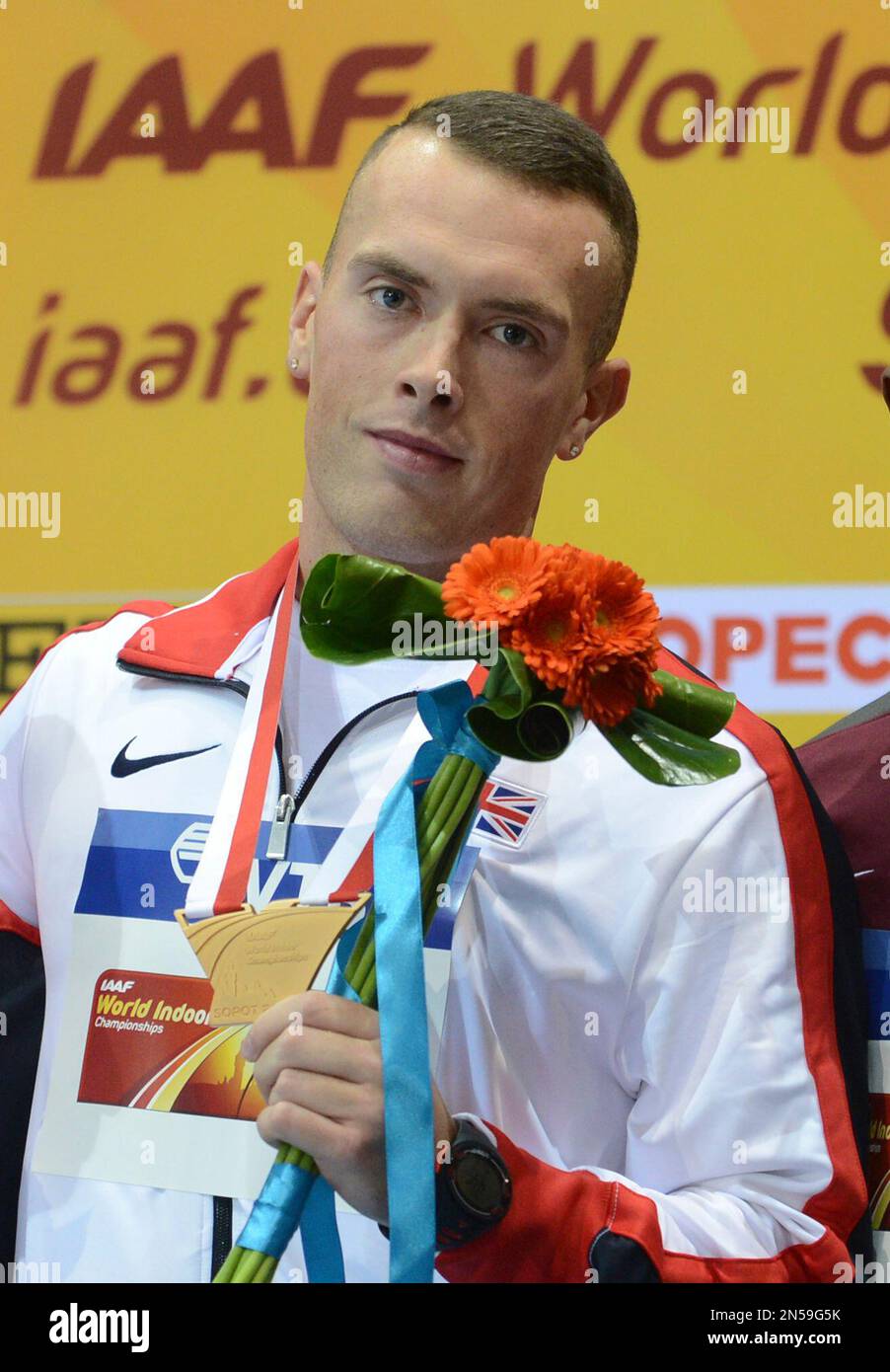 Britain's gold medal winner Richard Kilty shows off his medal during ...