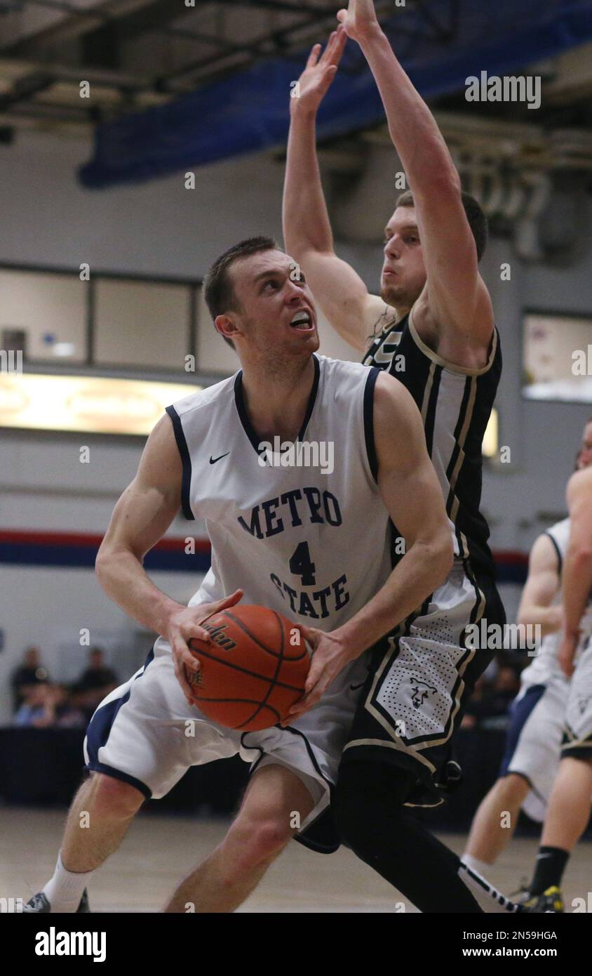 Metro State forward Nicholas Kay, left, goes up for shot as Colorado ...