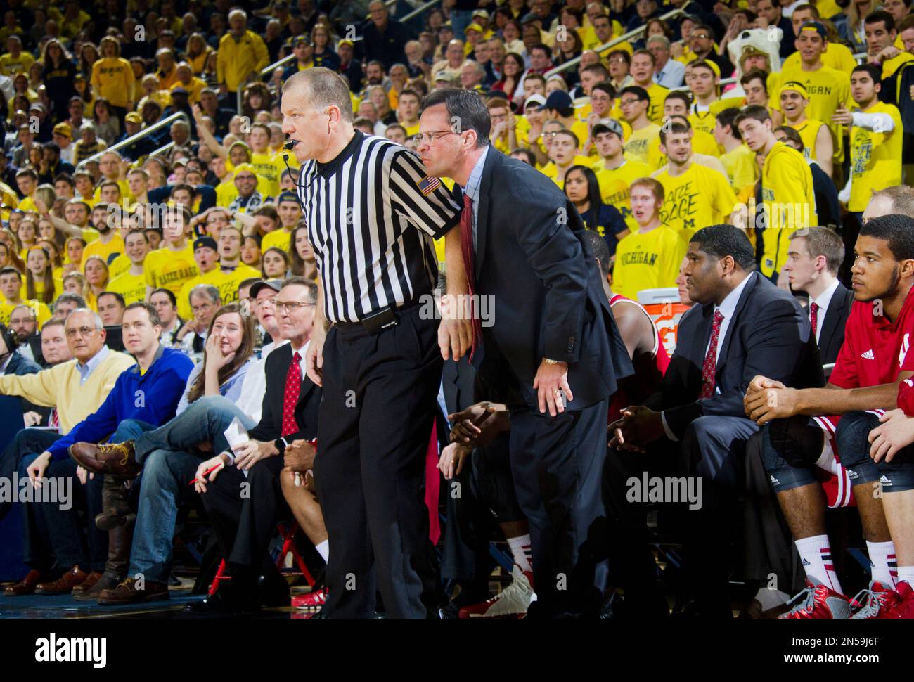 Indiana head coach Tom Crean is held back courtside by a referee in the ...