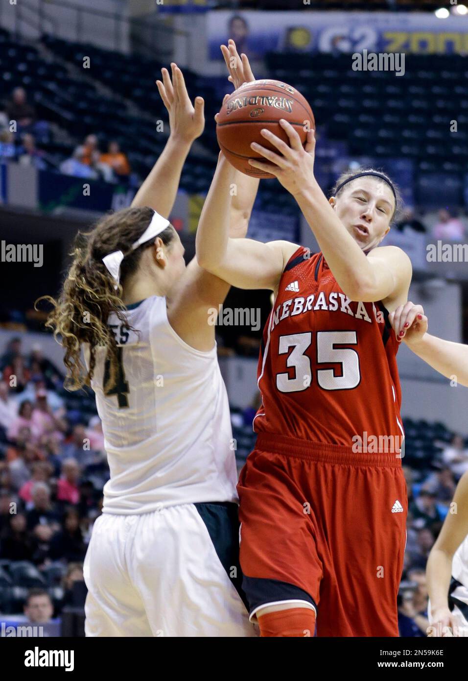 Nebraska forward Jordan Hooper, right, grabs a rebound over Michigan ...