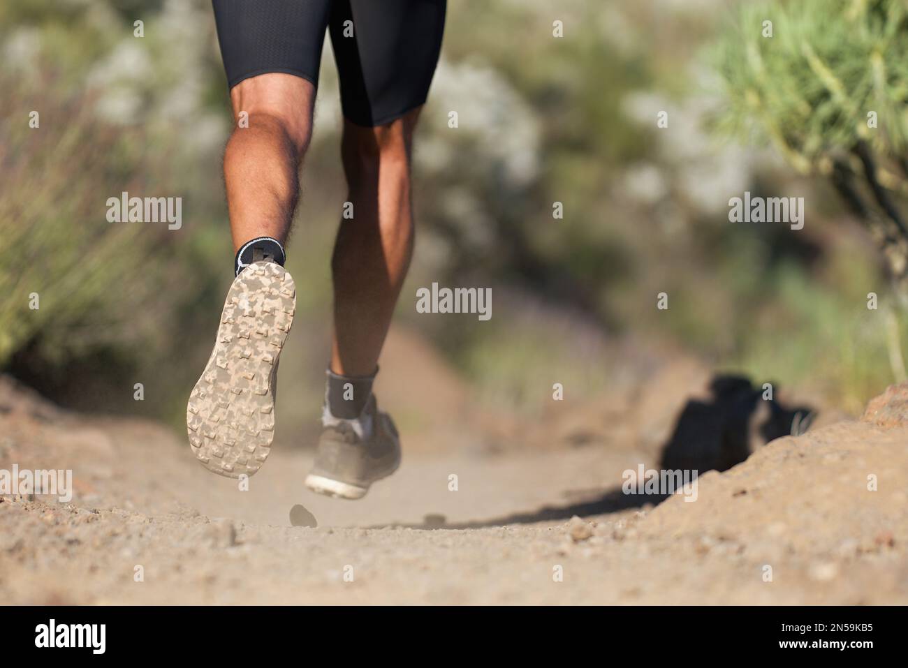 Athlete running sport feet on trail, selective focus on sole.Training ...